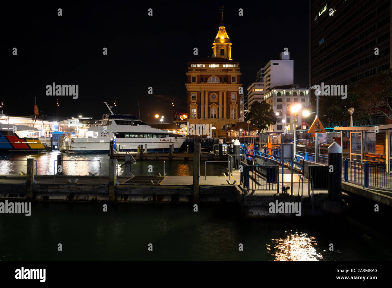 Night view of the Ferry Building and docked Fullers ferries. Auckland ...