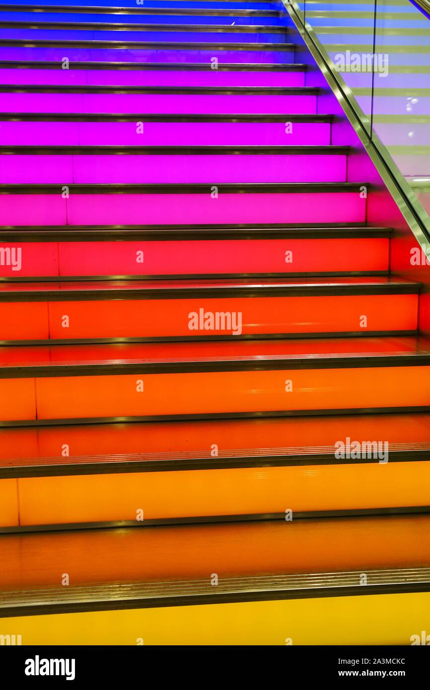 Steps on a colorful rainbow lit stairway Stock Photo - Alamy