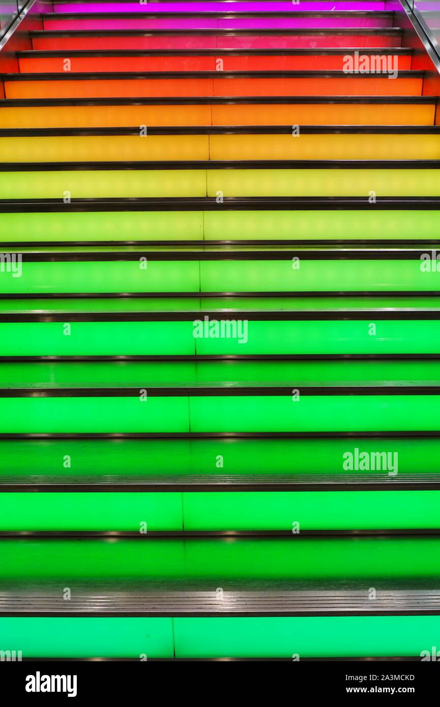 Steps on a colorful rainbow lit stairway Stock Photo - Alamy