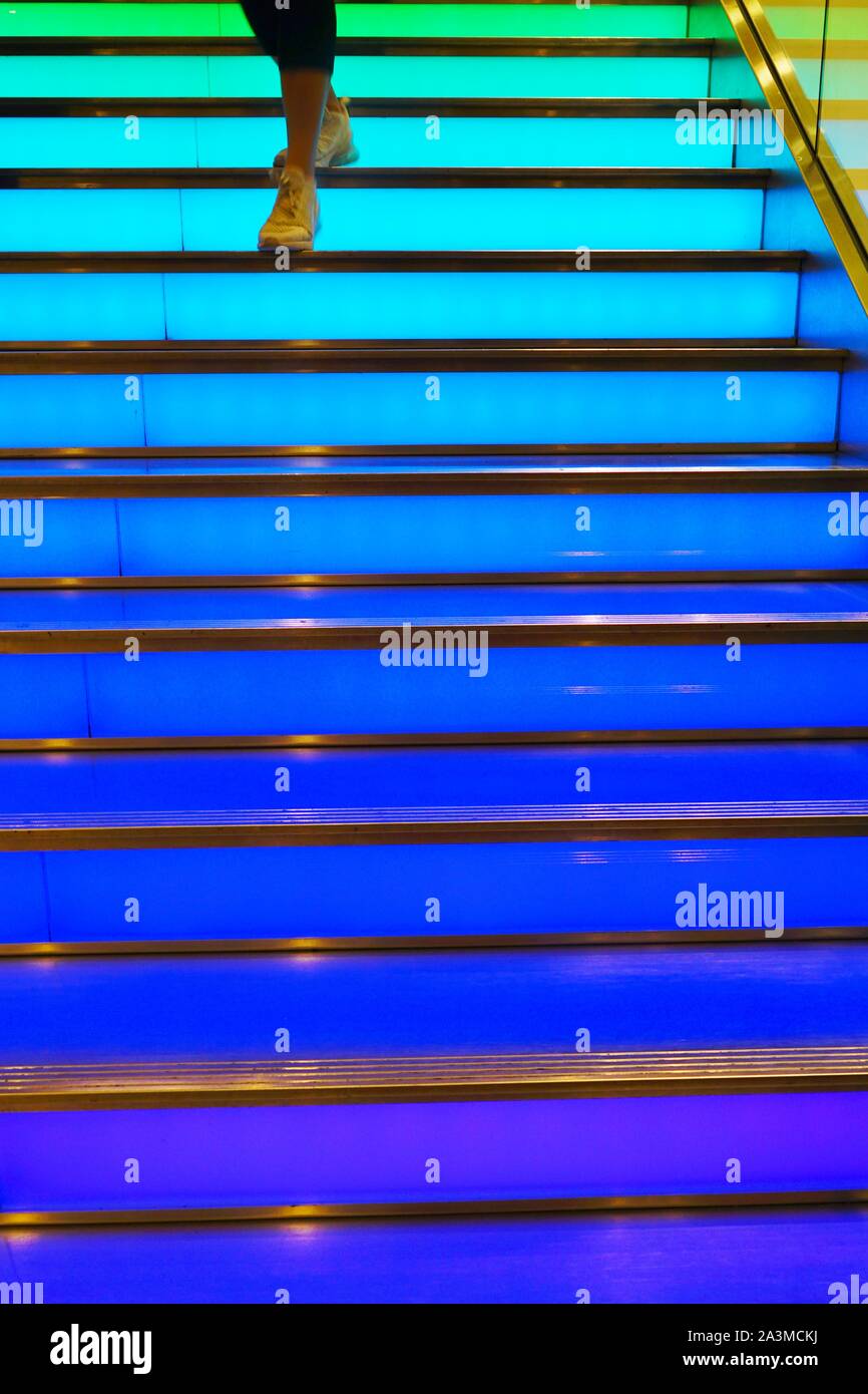 Steps on a colorful rainbow lit stairway Stock Photo - Alamy