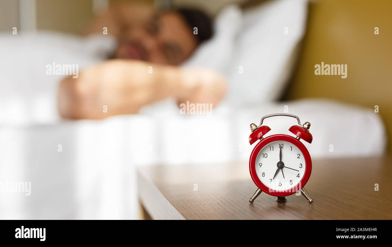 Arab man waking up in bed fully rested Stock Photo - Alamy