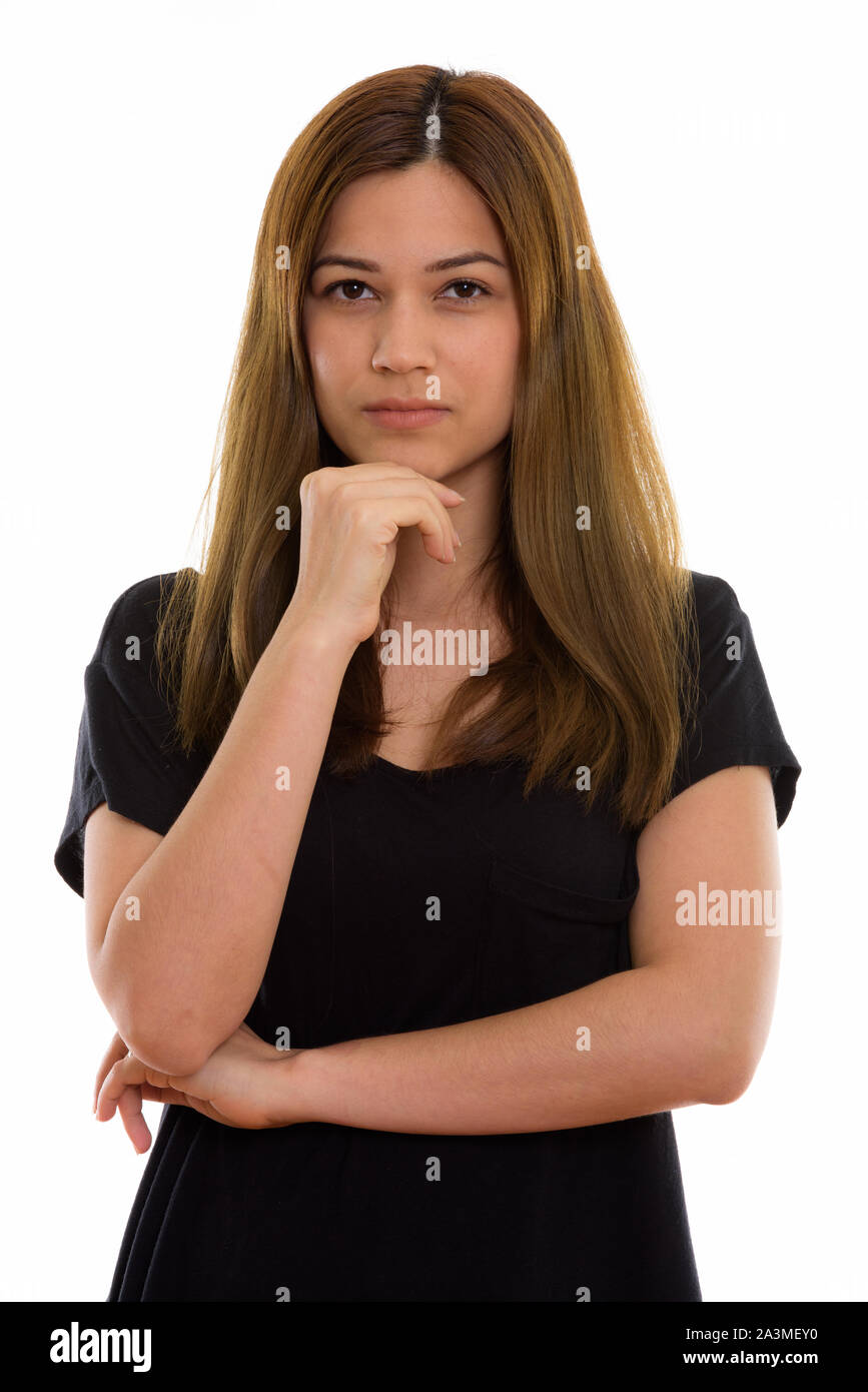 Studio shot of young beautiful woman thinking Stock Photo - Alamy