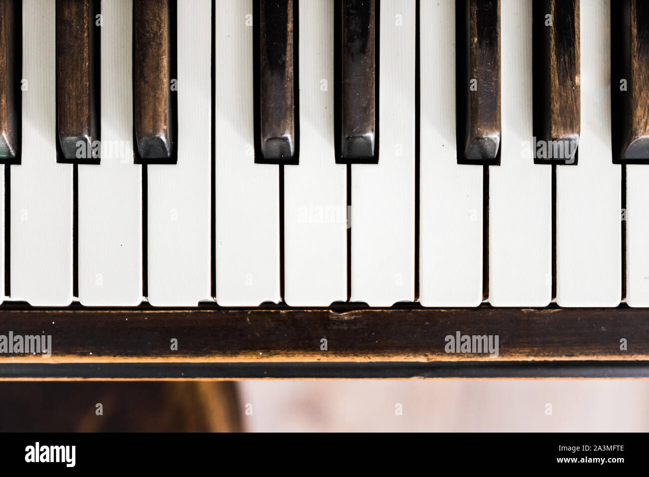 Grungy beat up piano keys of old player piano Stock Photo - Alamy