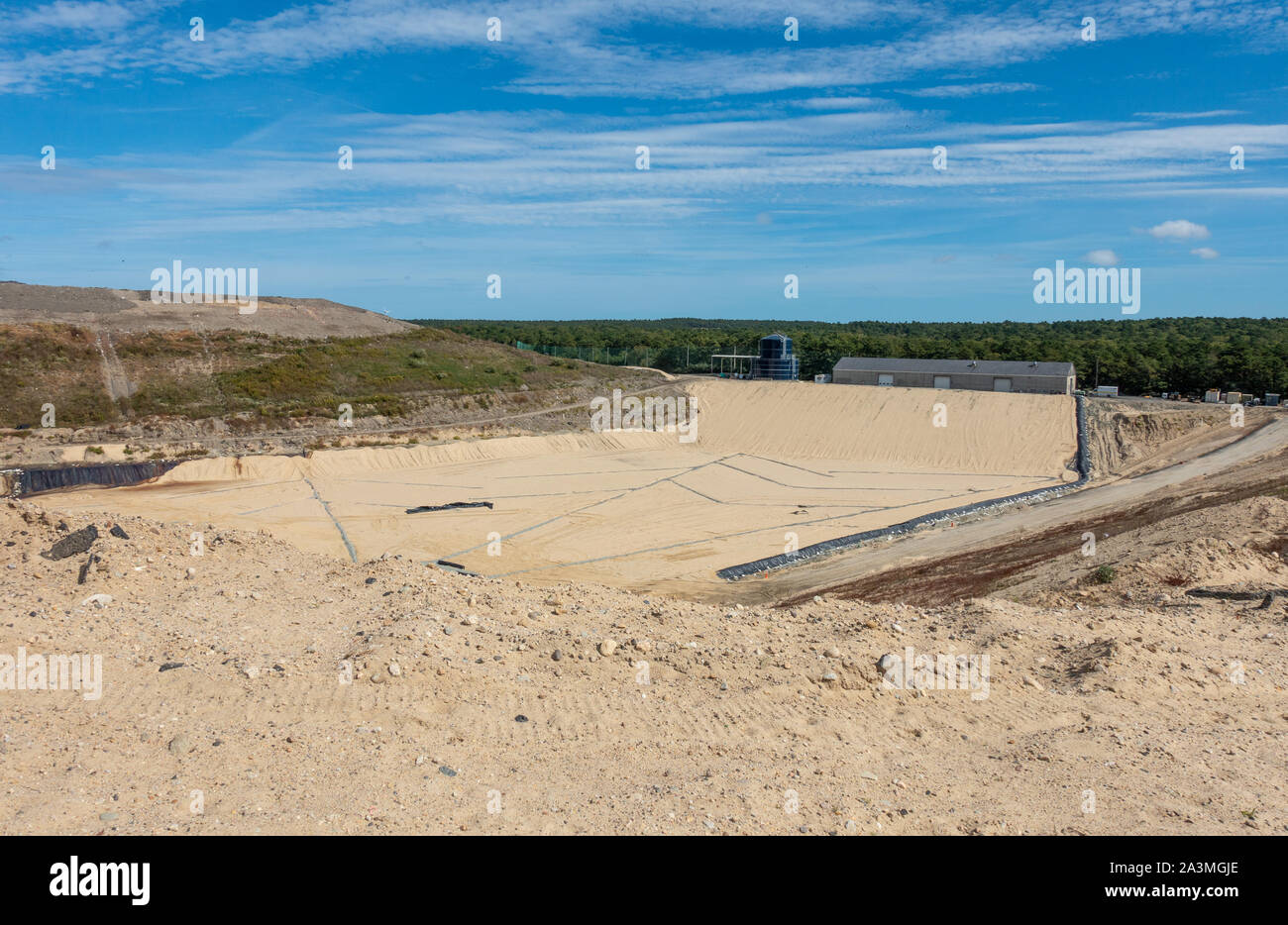New waste disposal cell being built at landfill with big hole excavated ...