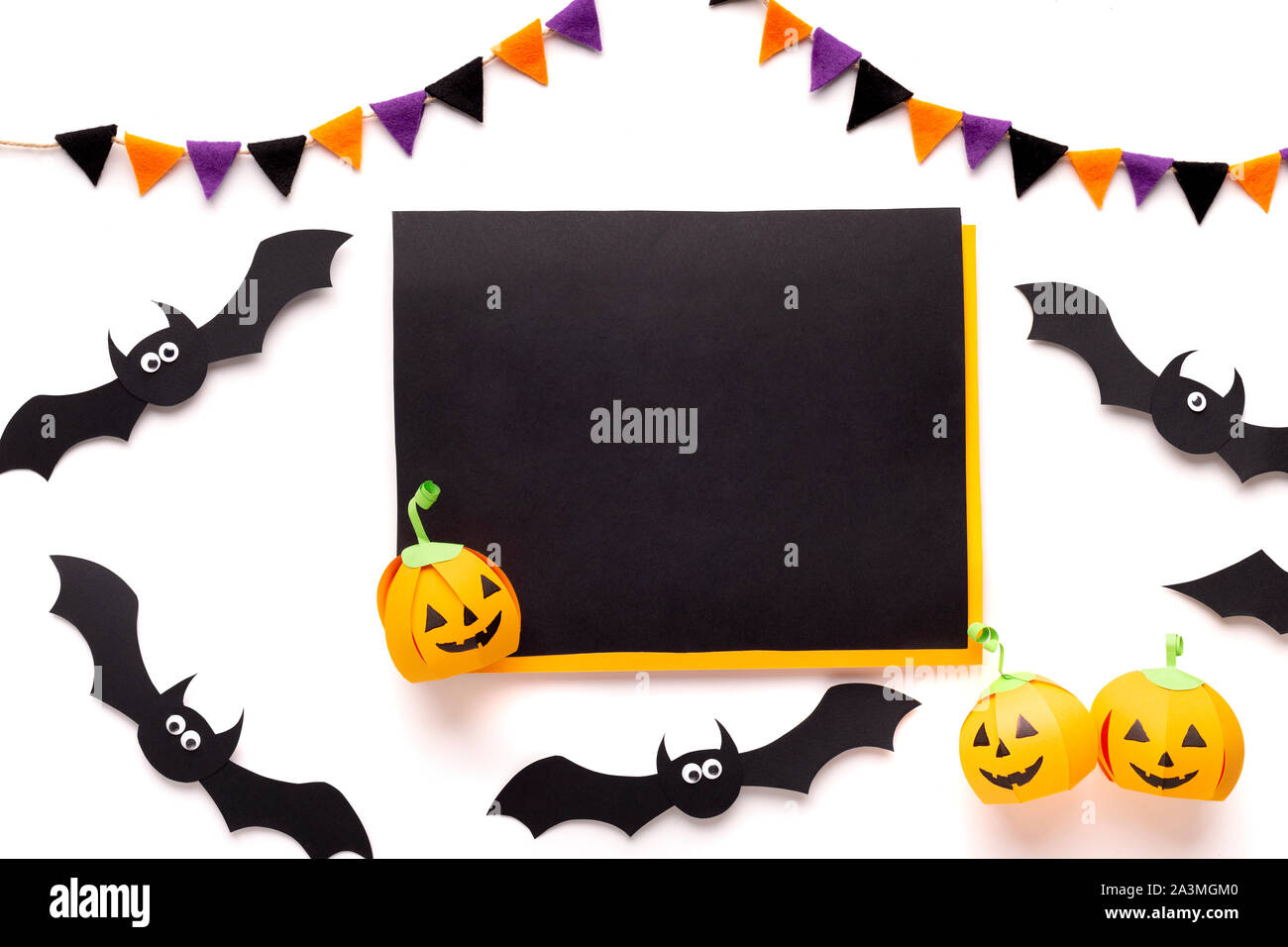 Halloween paper bats and pumpkins on white background Stock Photo - Alamy