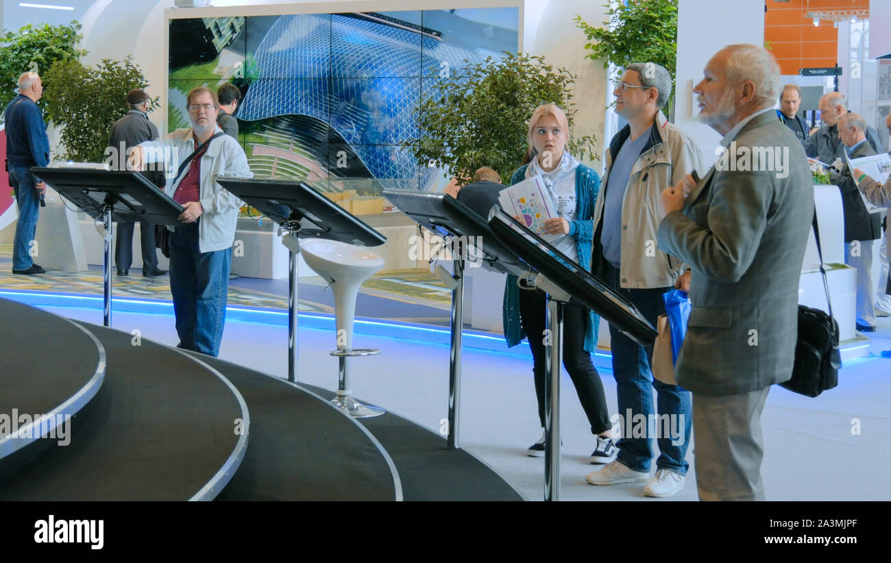 People using interactive touchscreen displays Stock Photo - Alamy