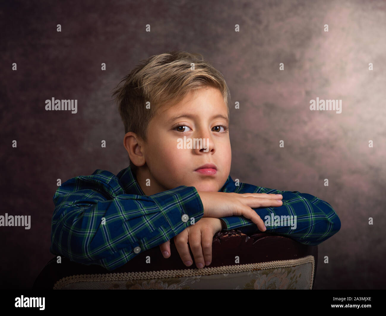 Boy unhappy chair hi-res stock photography and images - Alamy