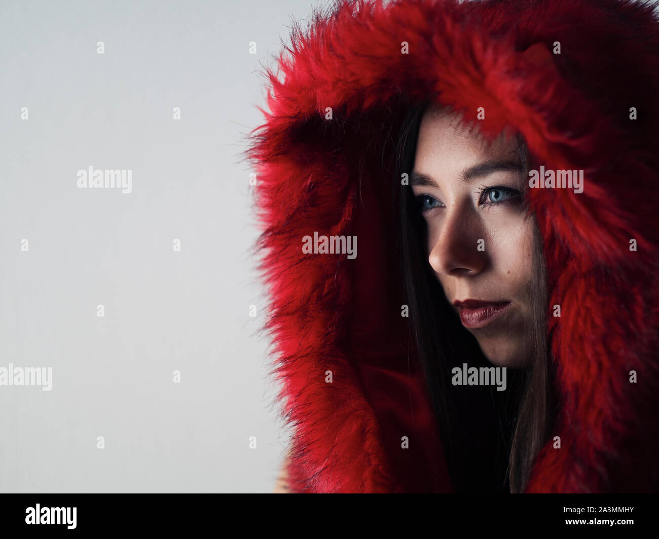woman wearing big faux red fur coat Stock Photo - Alamy