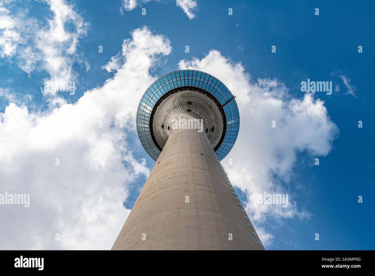 Looking up at the Rhein Tower (Rheinturm) TV tower on the banks of the ...