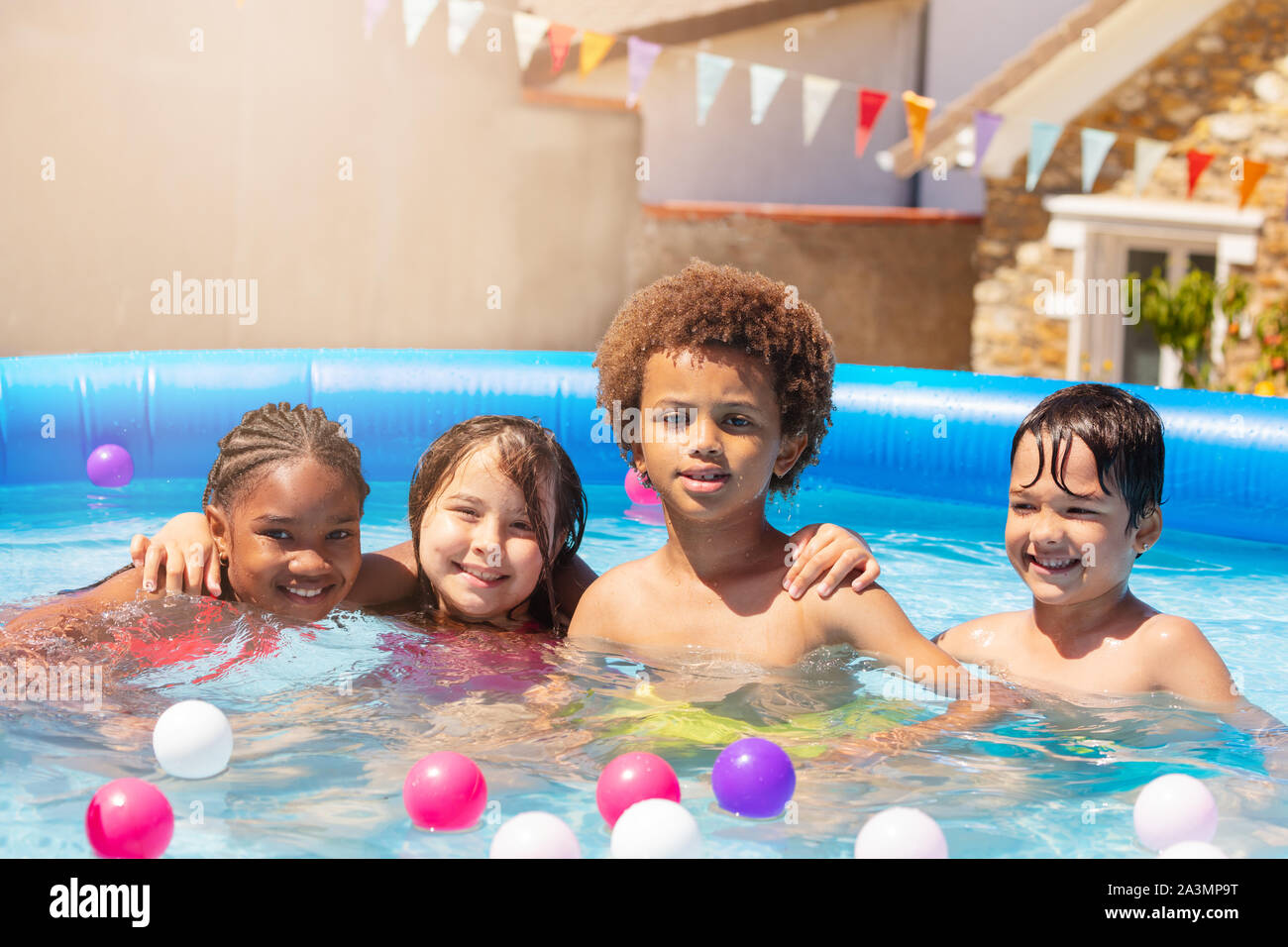 Four friends swimming pool vacation hi-res stock photography and images ...