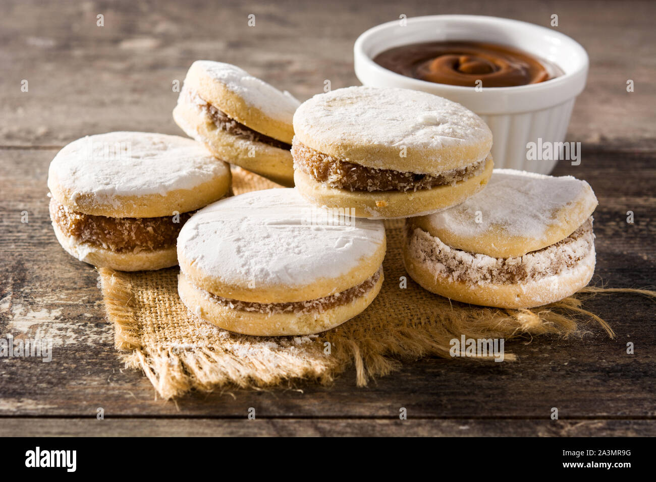 Traditional Argentinian alfajores with dulce de leche and sugar on ...