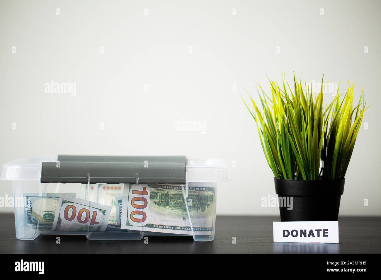 Hand with pound coin donate hi-res stock photography and images - Alamy