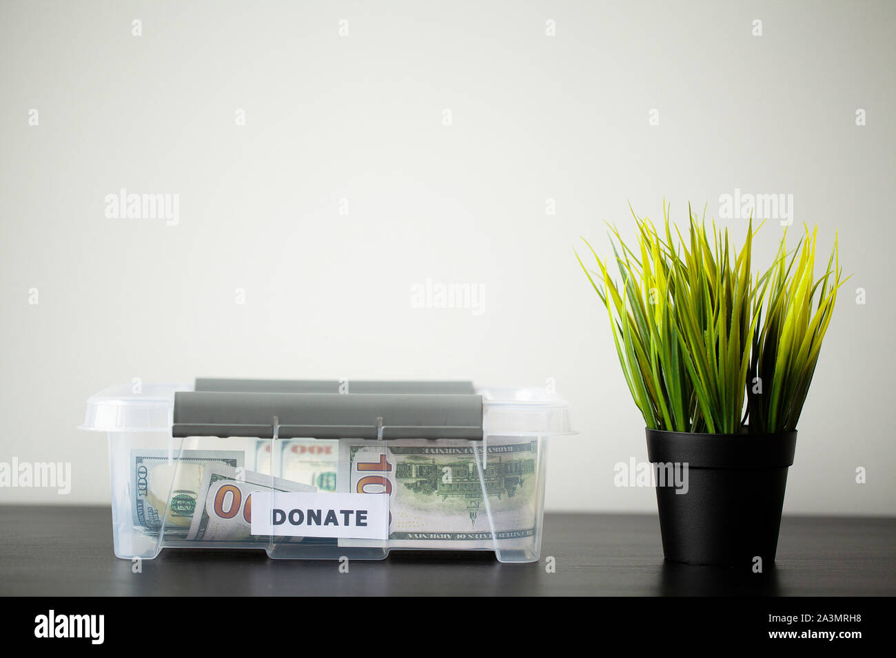 Hand with pound coin donate hi-res stock photography and images - Alamy