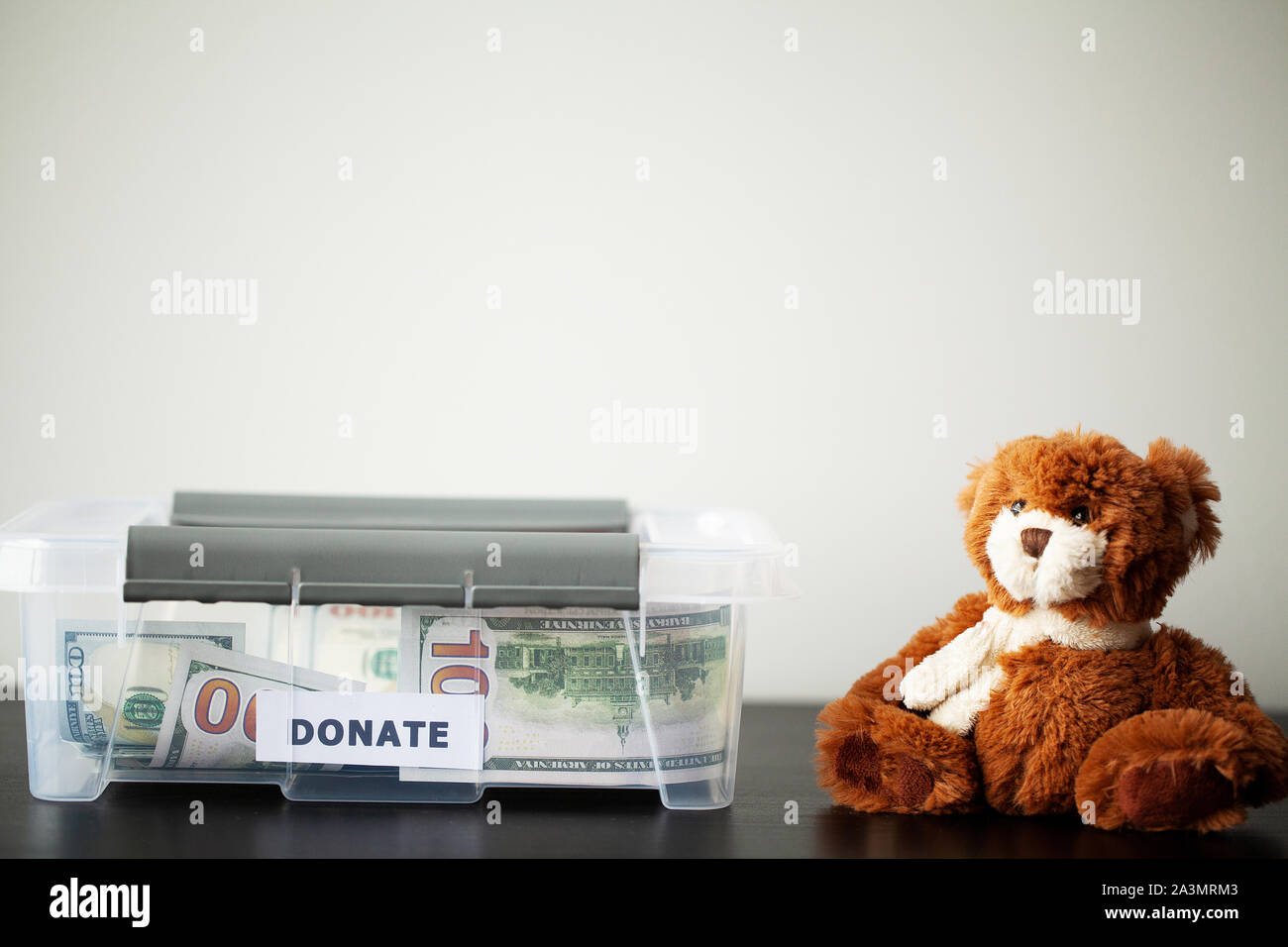 Hand with pound coin donate hi-res stock photography and images - Alamy
