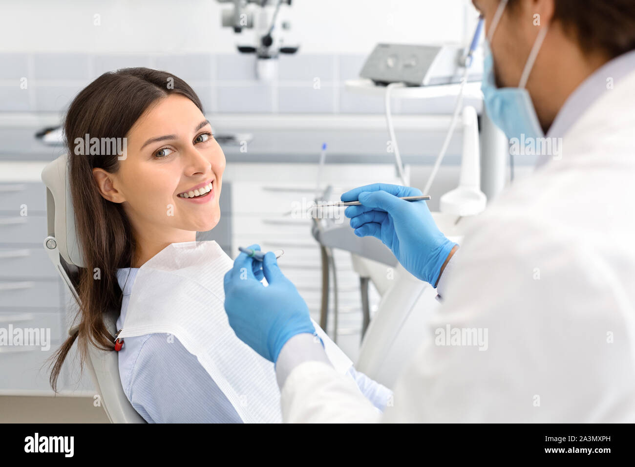 Happy woman making check up in dental clinic Stock Photo - Alamy