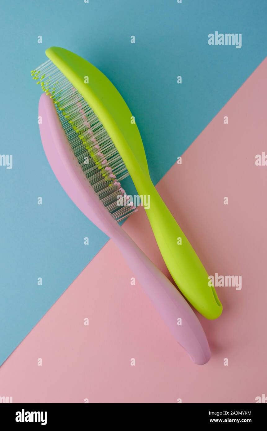 Hair care products. Colorful Hair combs for scalp massage on colorful ...