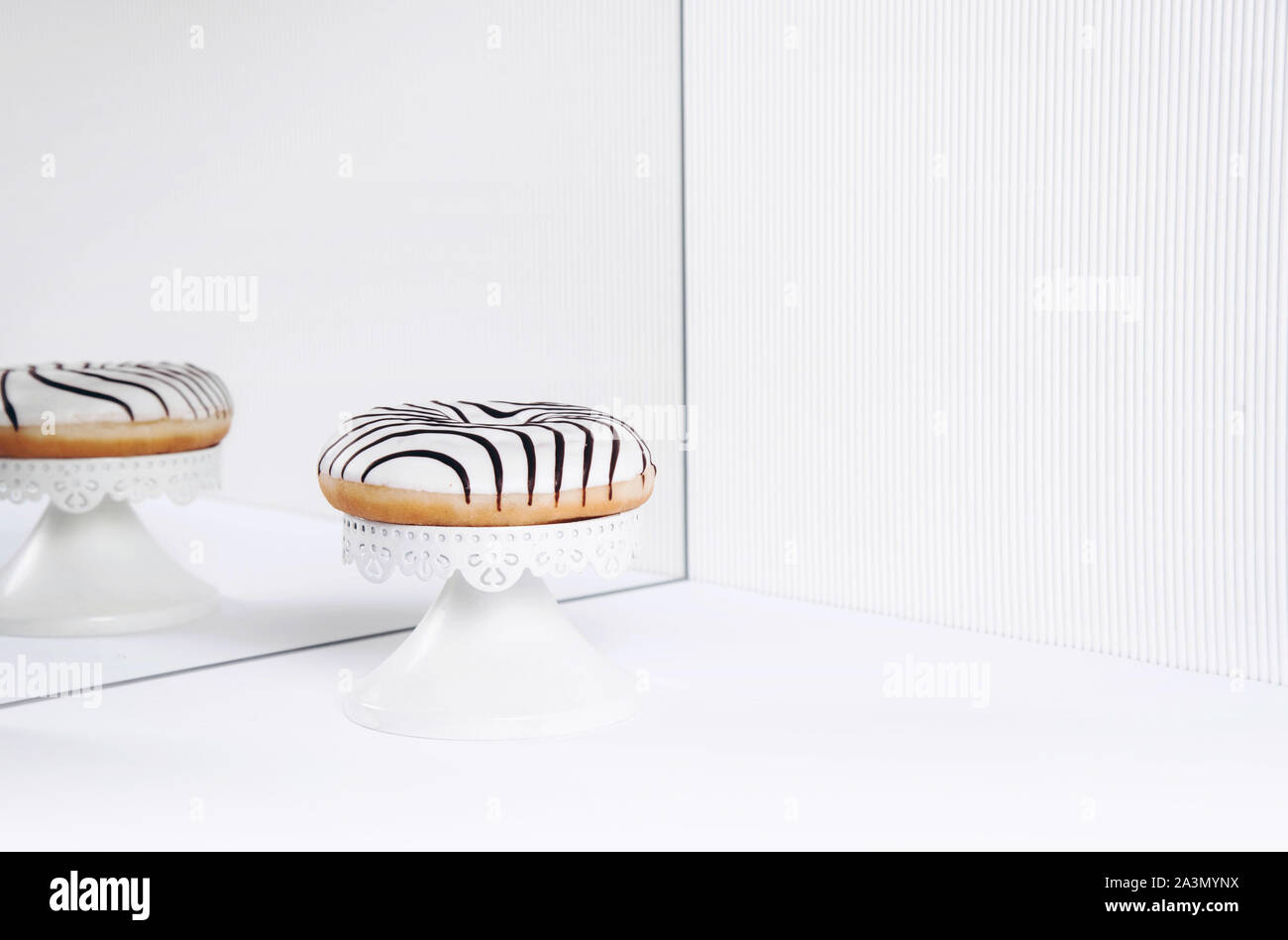 Striped donuts on a white background Stock Photo - Alamy