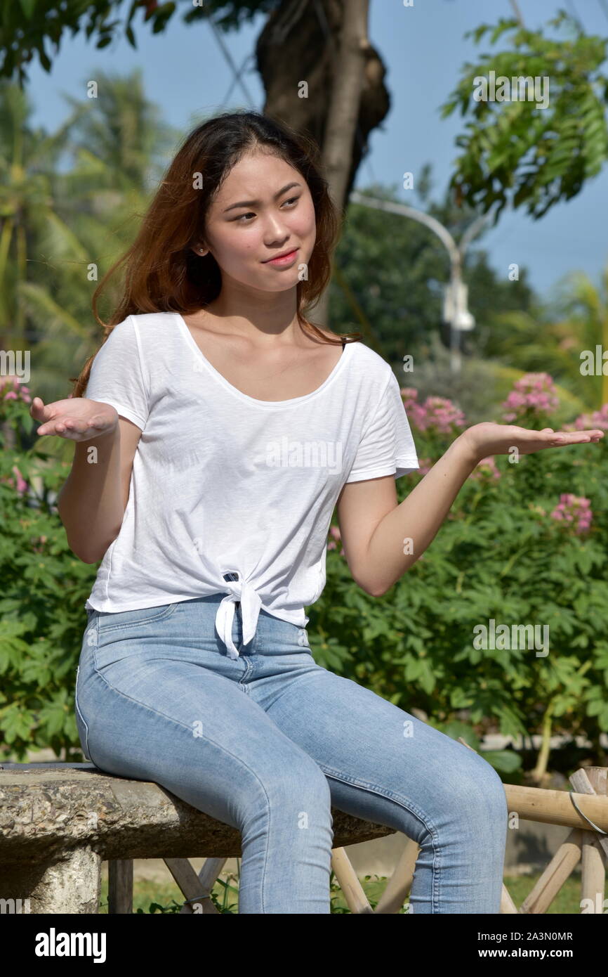 An Undecided Diverse Woman Stock Photo - Alamy