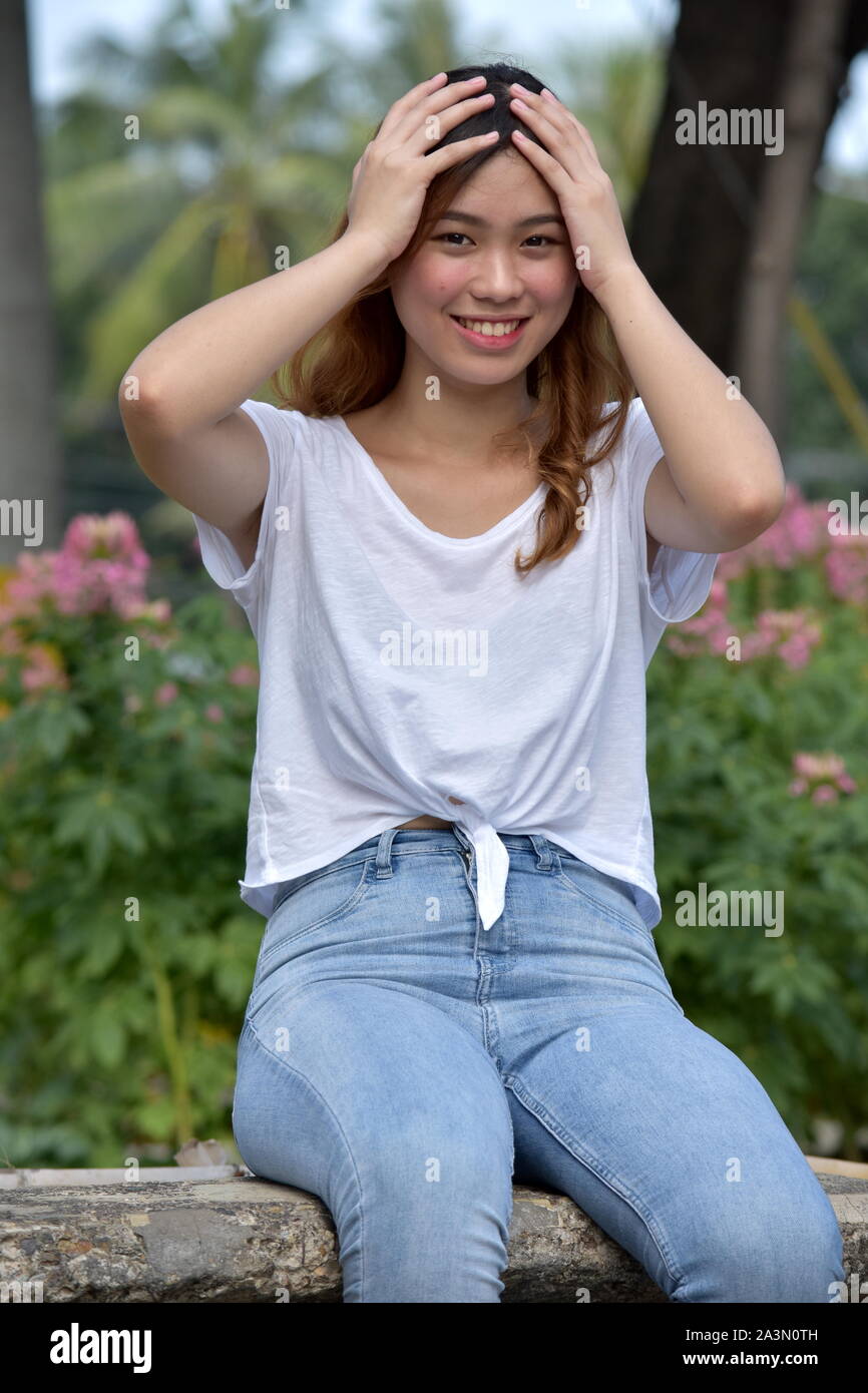 Forgetful Young Asian Woman Stock Photo - Alamy