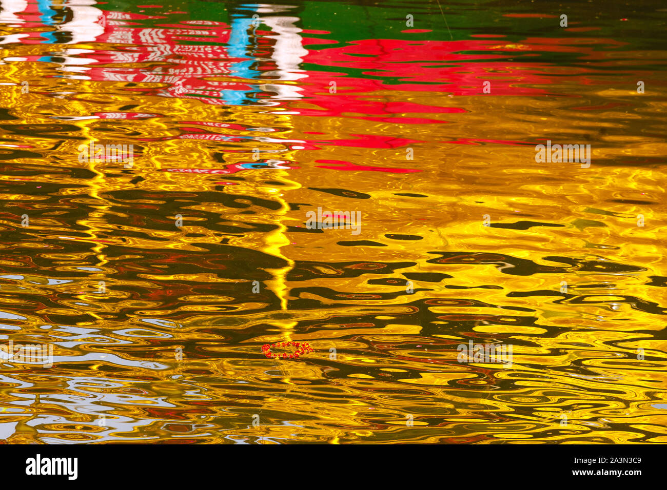 Colorful abstract reflection on water surface Stock Photo - Alamy