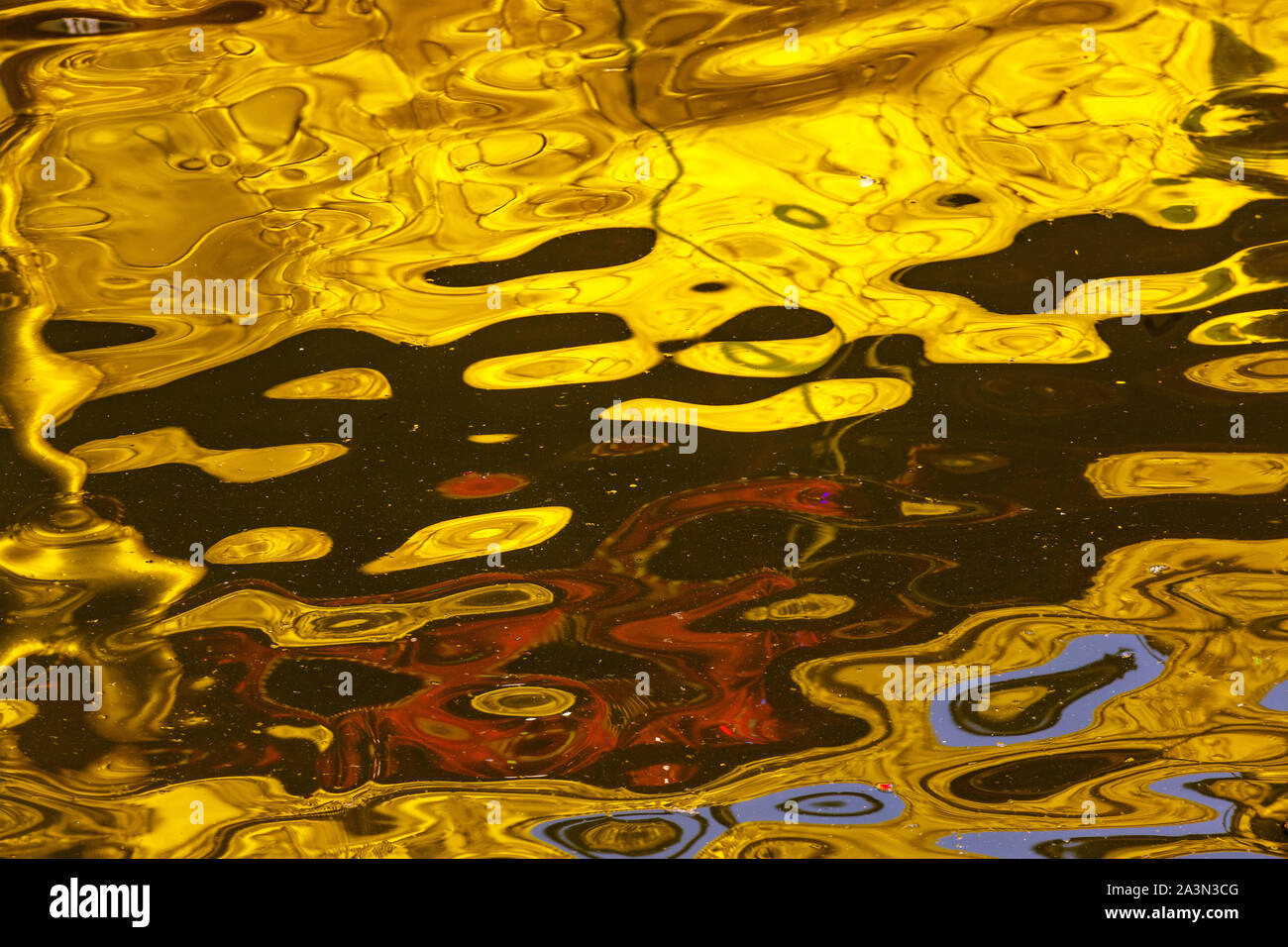 Colorful abstract reflection on water surface Stock Photo - Alamy