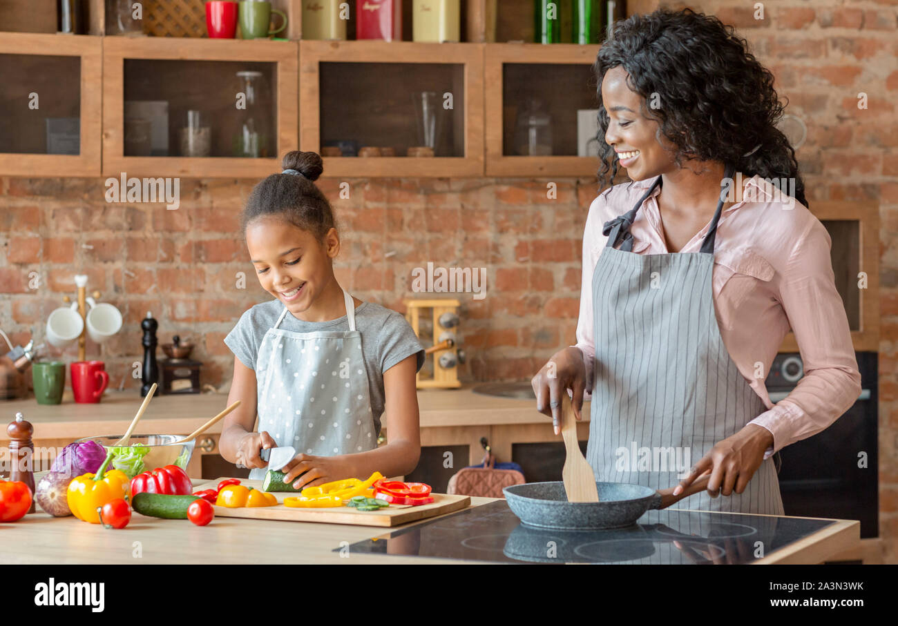 Little Girl Cooking With Mom