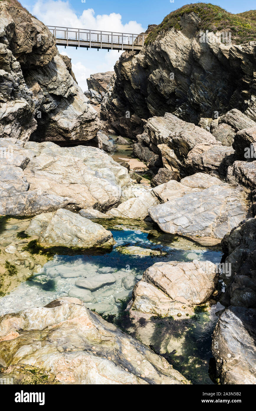 The footbridge connecting the mainland to Porth Island at Porth Beach ...