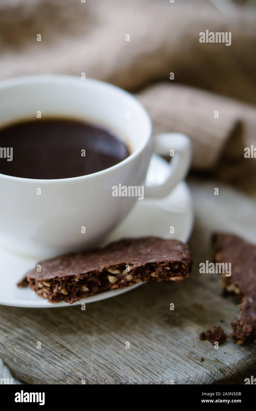 Cup of coffe with milk and chocolate cookies on warm wool blanket Stock ...