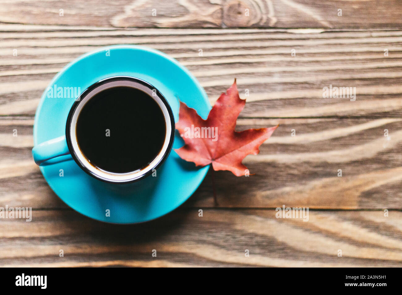Autumn composition of autumn leaves and a Cup of coffee on wood ...