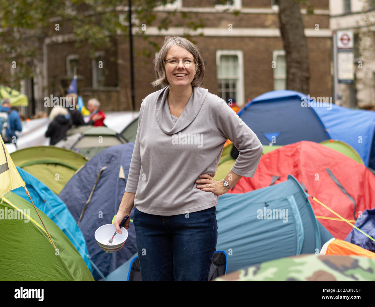 Lady standing amidst the tents set up at the Women of World War II ...