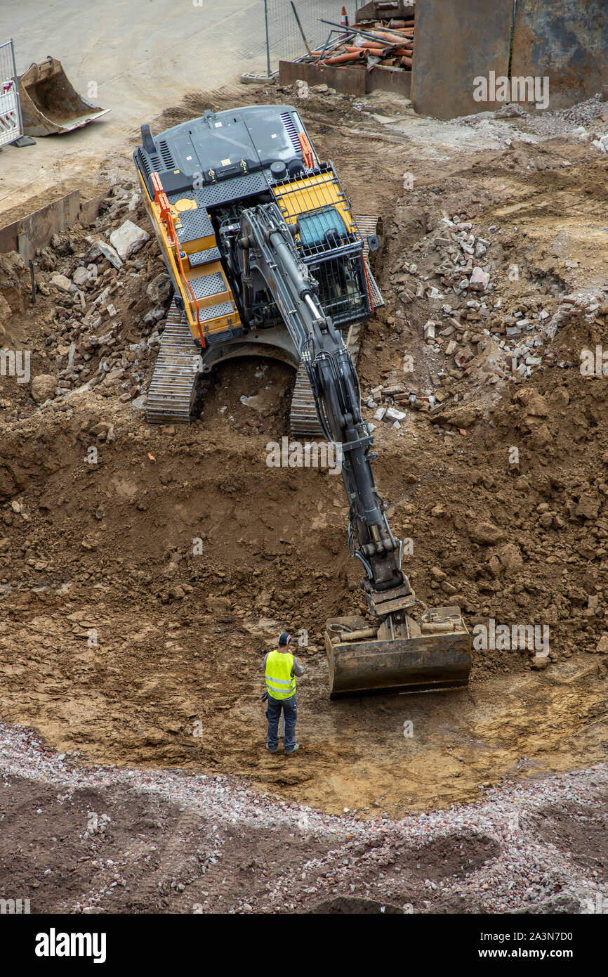 Construction work, dredging a construction pit for a residential ...