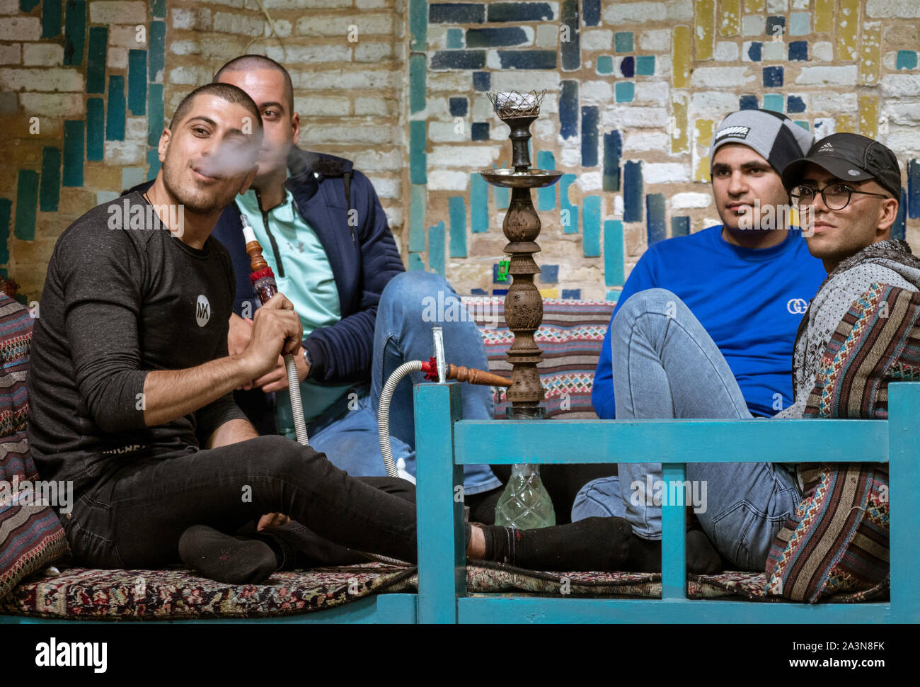 Tehran, Iran - 2019-04-05 - Men smoking hookah water pipe in restaurant ...
