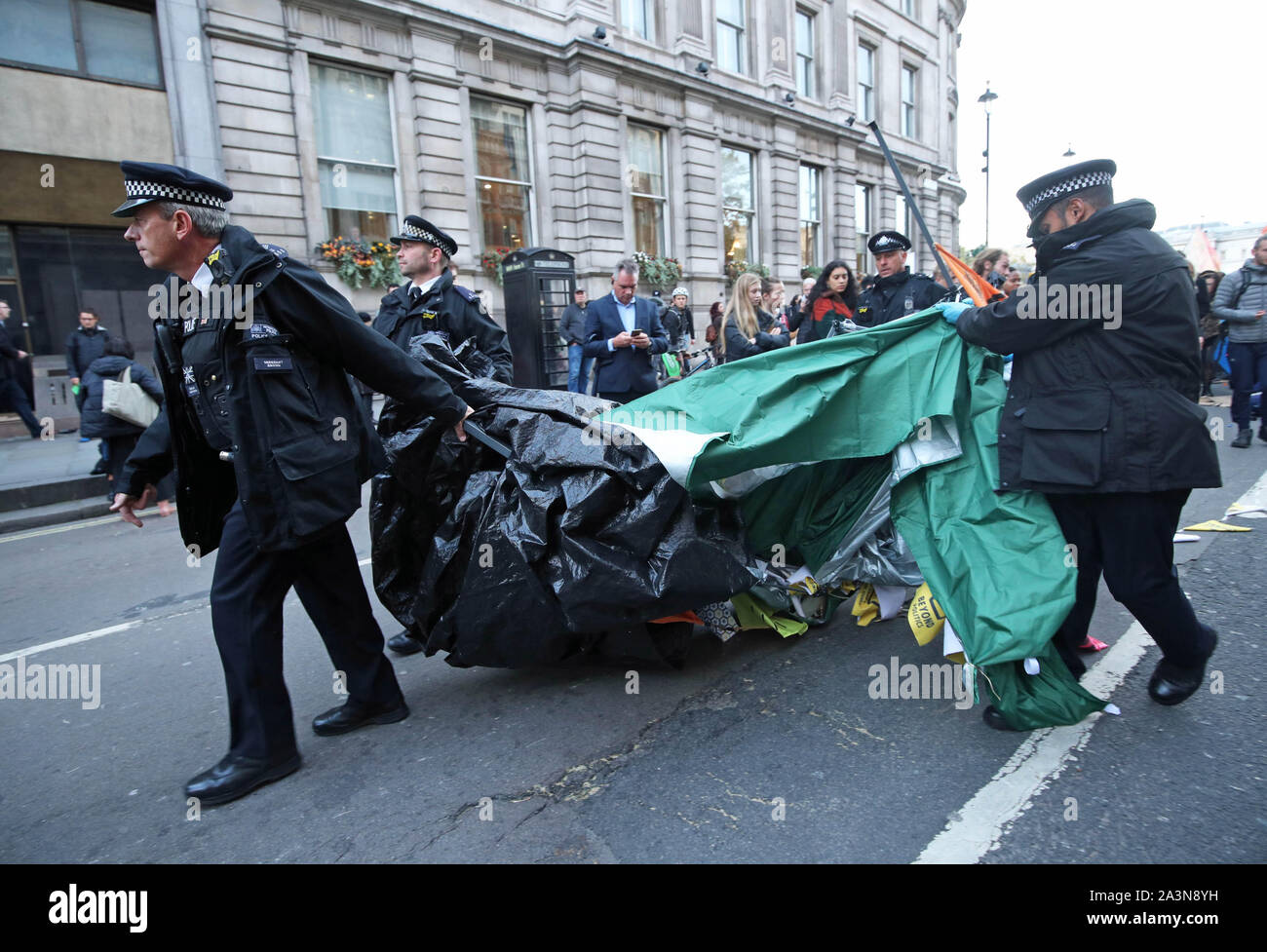 Police removing tents on Whitehall, during the third day of an ...