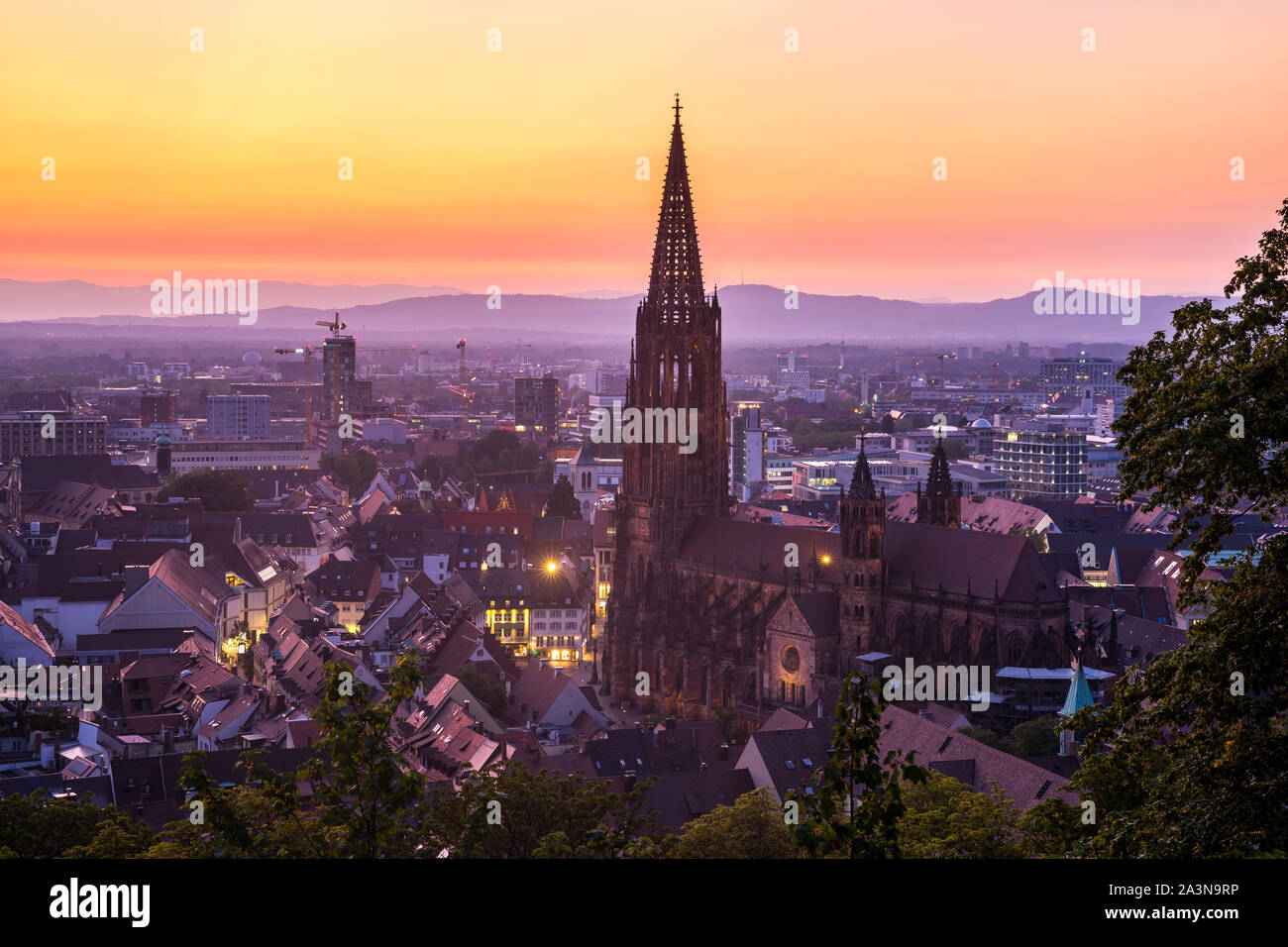 Germany, Amazing red sky sunset over medieval city freiburg im breisgau ...