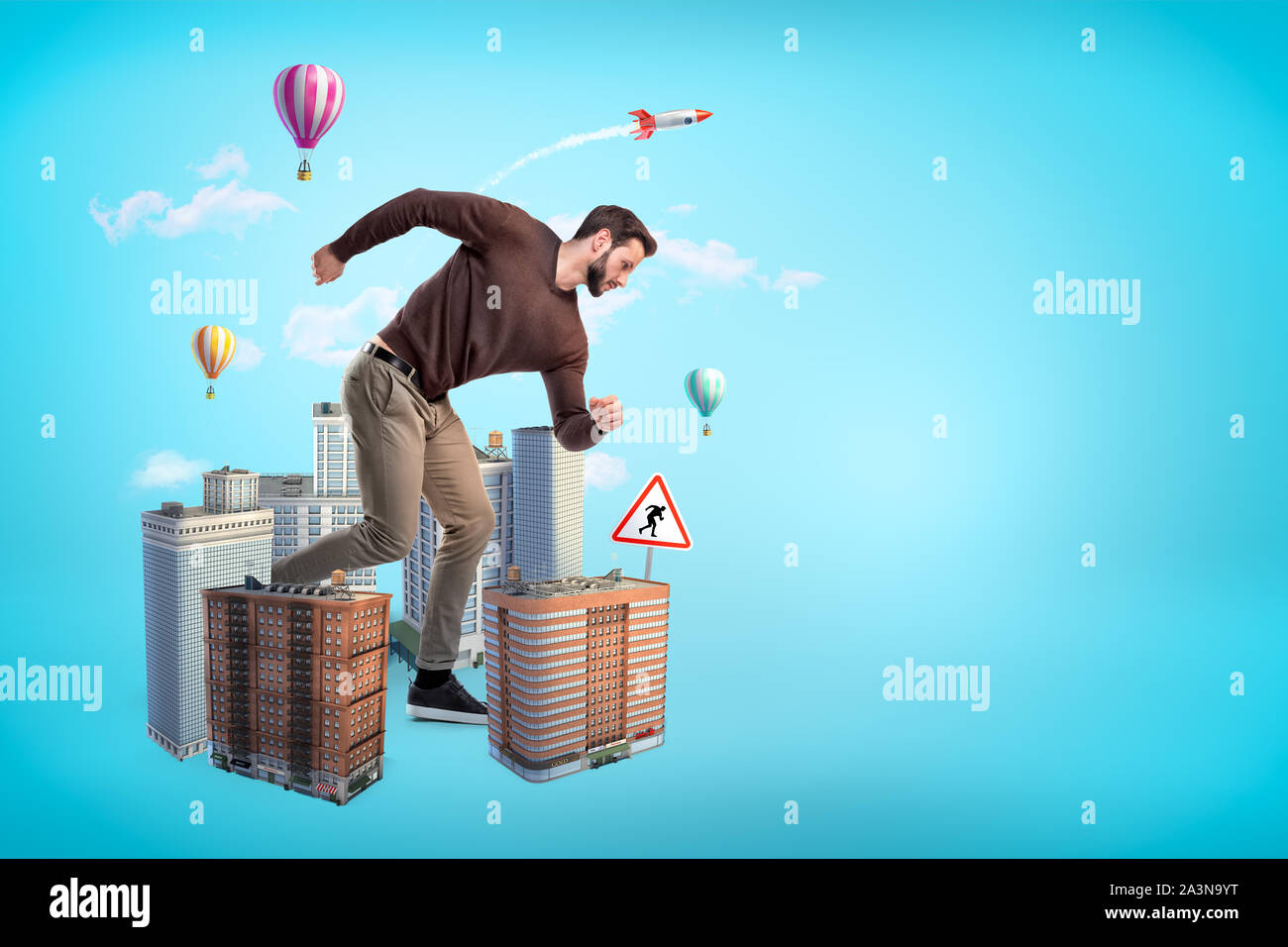 Side view of giant young running man with high-rise buildings at his ...