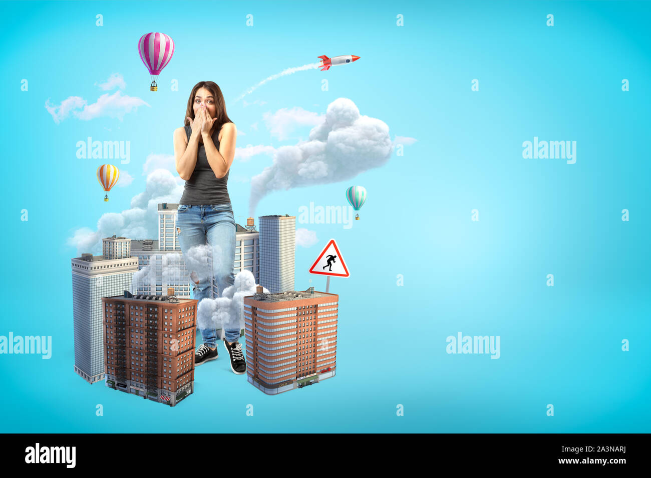 Scared giant young woman covering mouth with hands, standing amid high ...