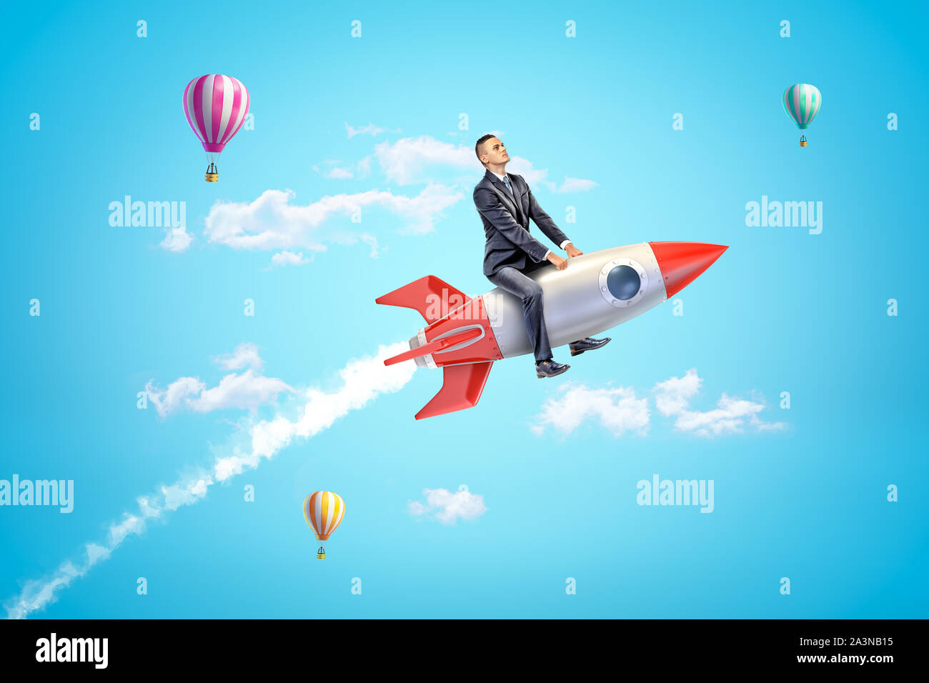 Young businessman riding toy rocket in blue sky with hot air balloons ...