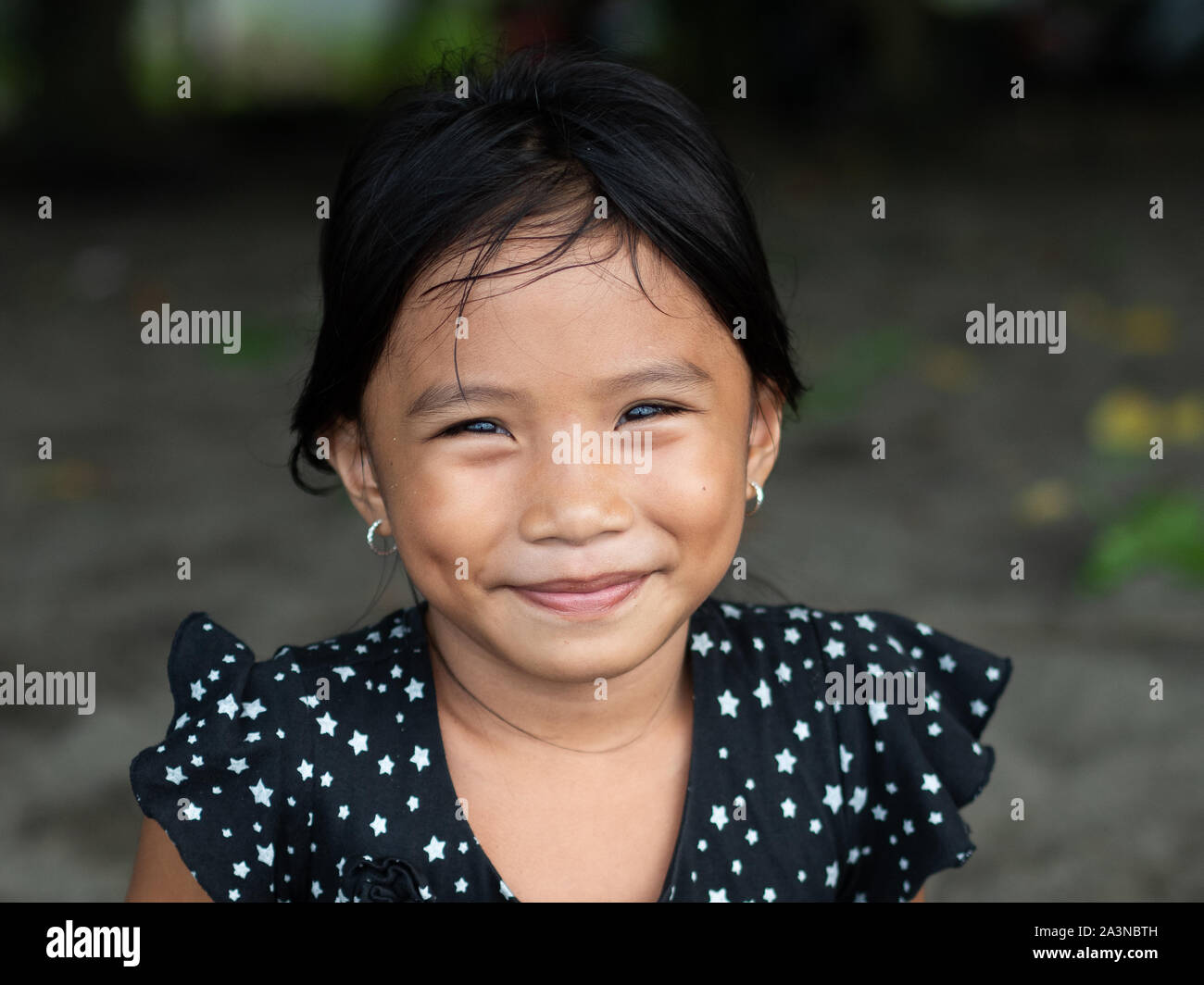 Smiling portrait of a little girl from the Philippines Stock Photo - Alamy