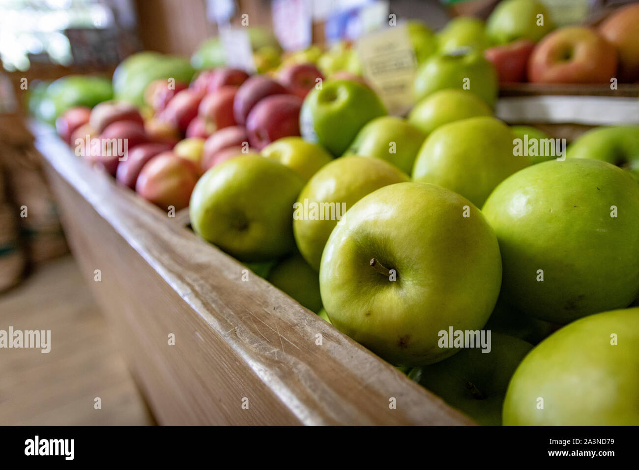 A variety of apples on display for sale at a farmer's market or fruit ...