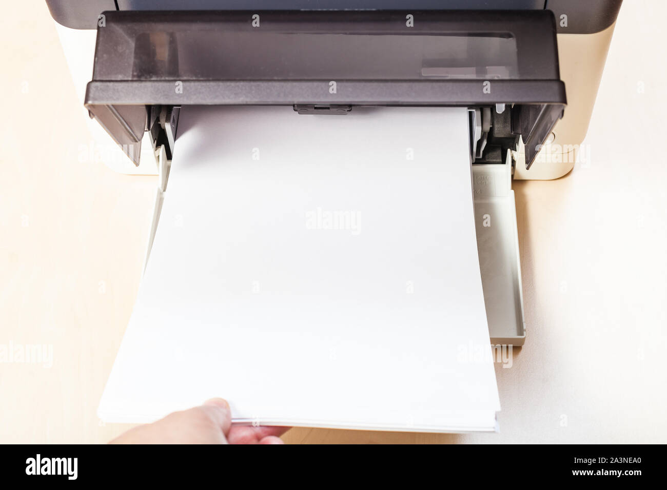 loading of blank paper sheets in printer tray of multi function device ...