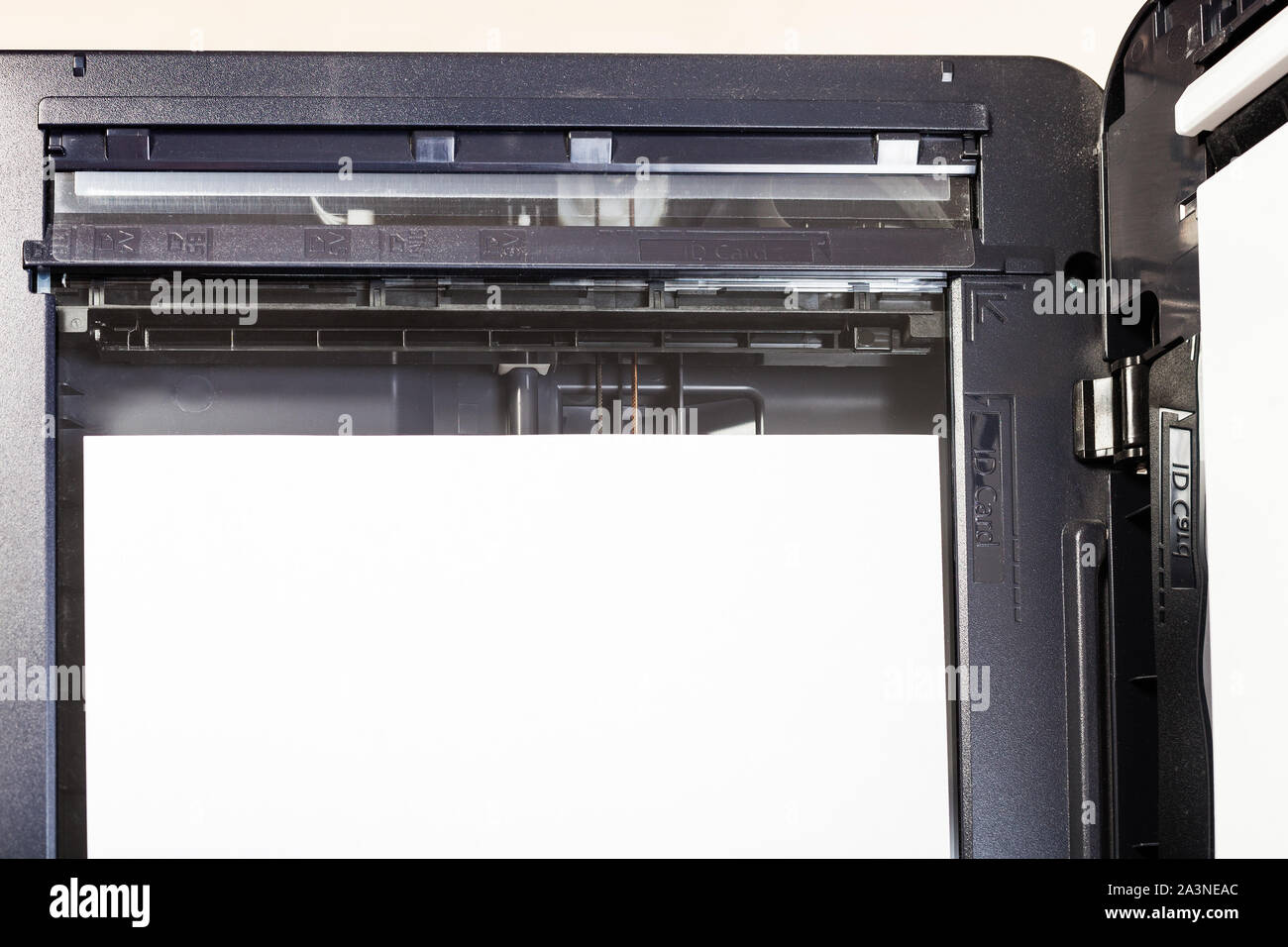 top view of sheet of paper on glass of scanner in multi function device ...