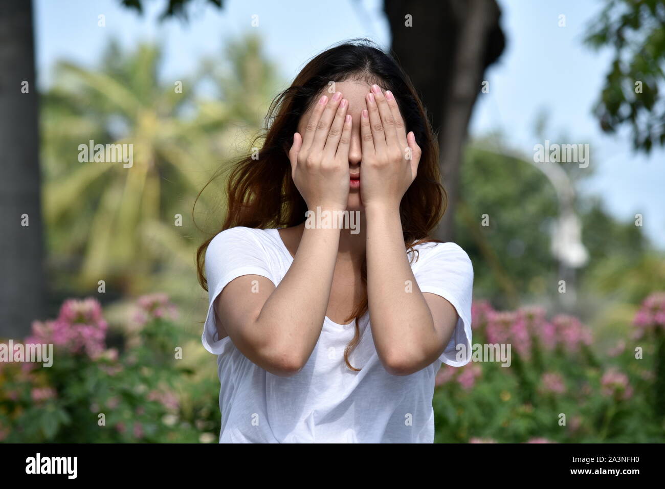 An Ashamed Youthful Filipina Female Stock Photo - Alamy