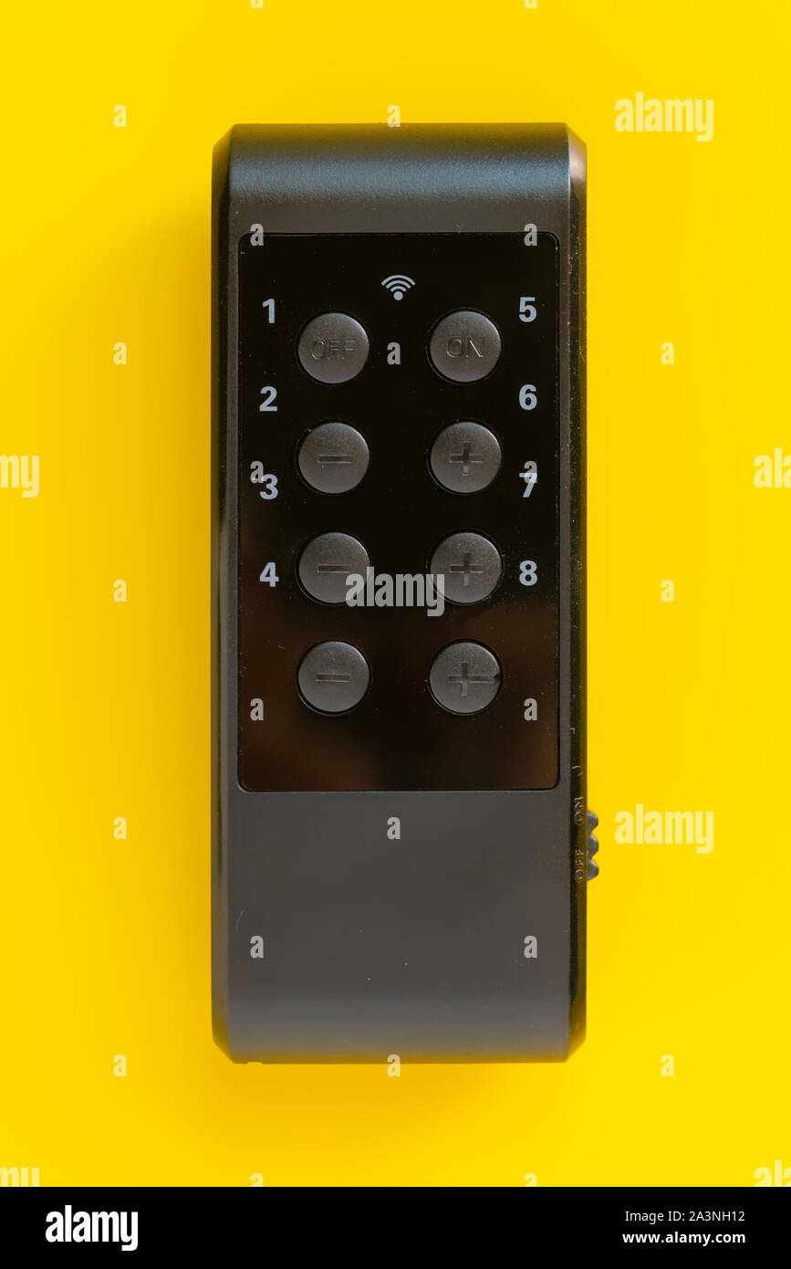 simple remote wireless controlle on the color background isolated top ...