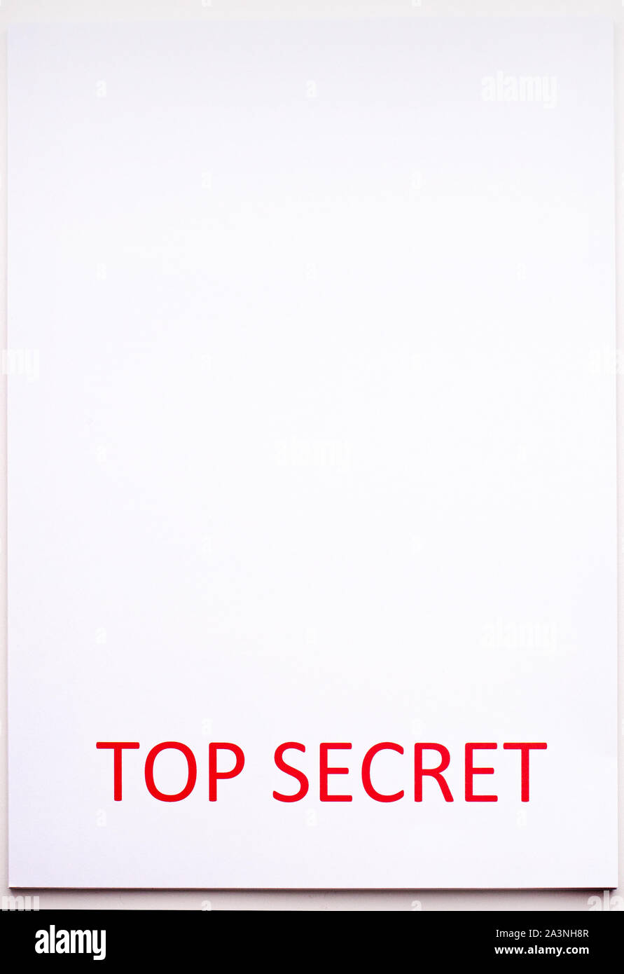 Red inscription TOP SECRET on a white sheet. Secrets and conspiracies ...
