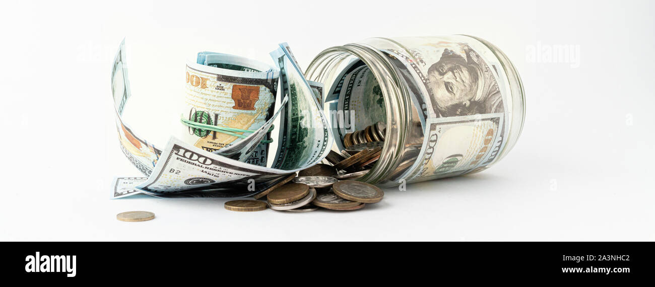 glass banks with coins and currency savings money Stock Photo - Alamy