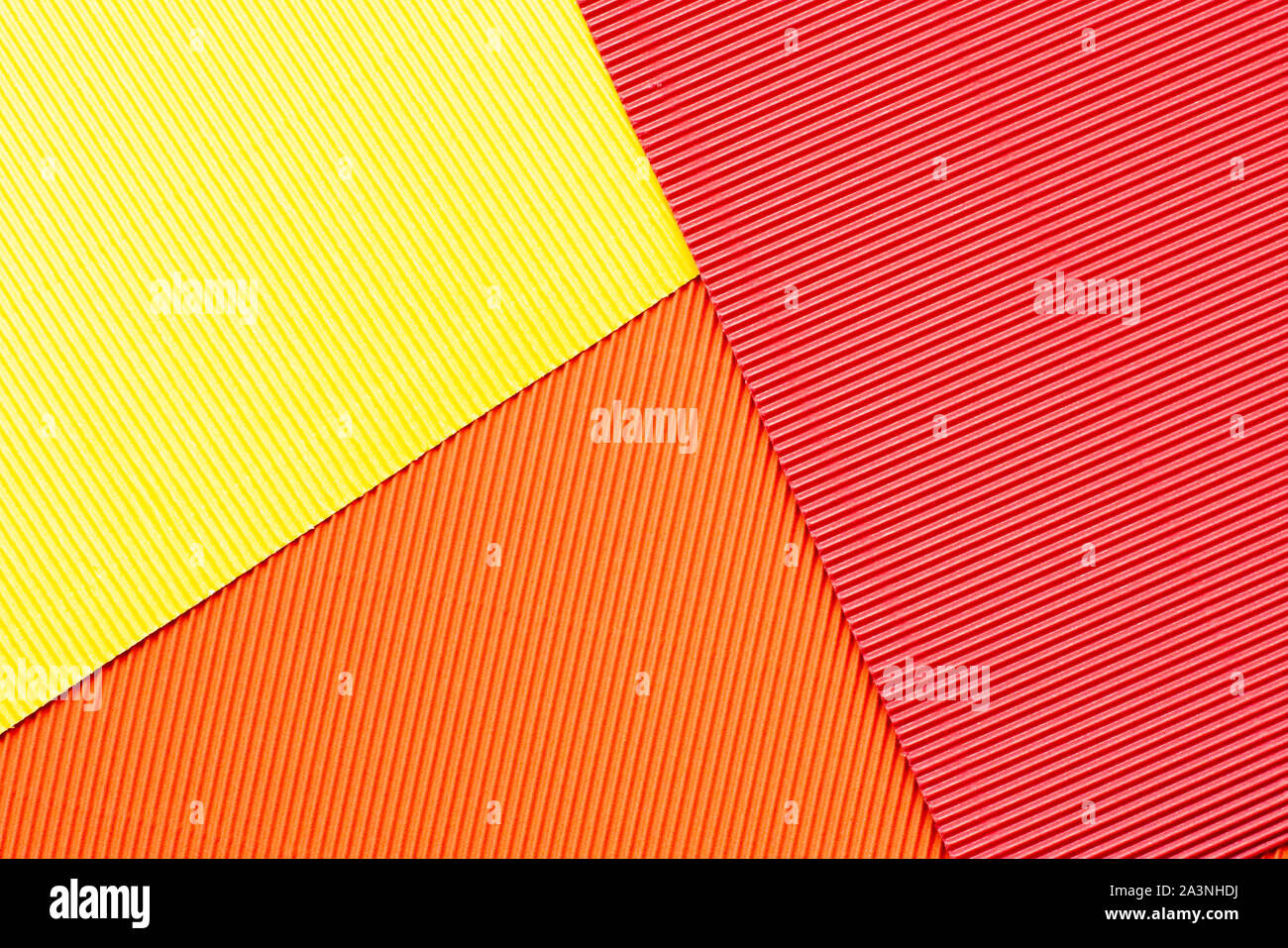 Sheets of colored embossed paper. Laid one on top of the other ...