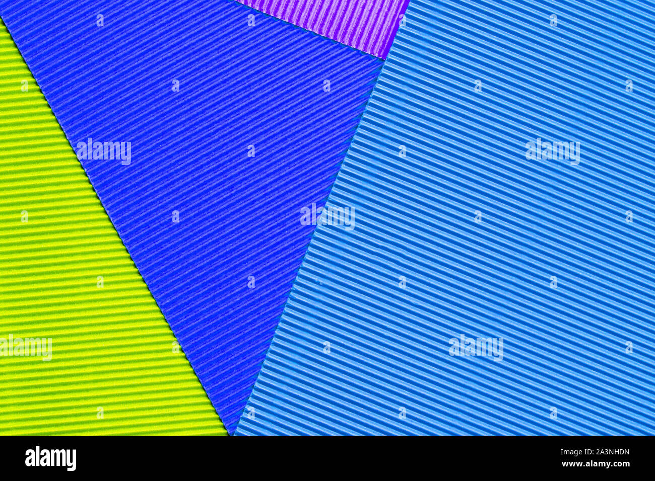 Sheets of colored embossed paper. Laid one on top of the other ...