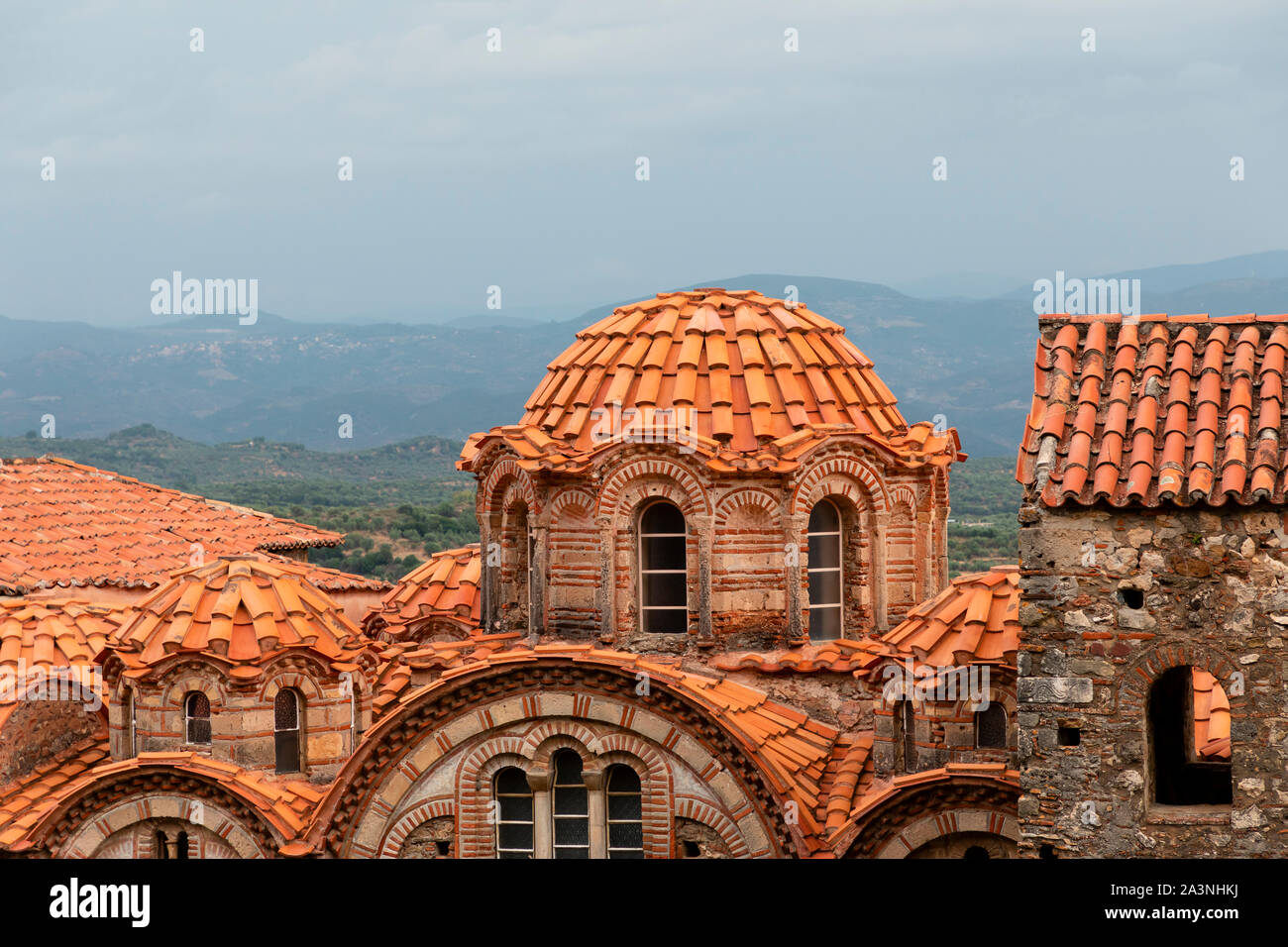 An old and deteriorating brick building and structure with terracotta ...