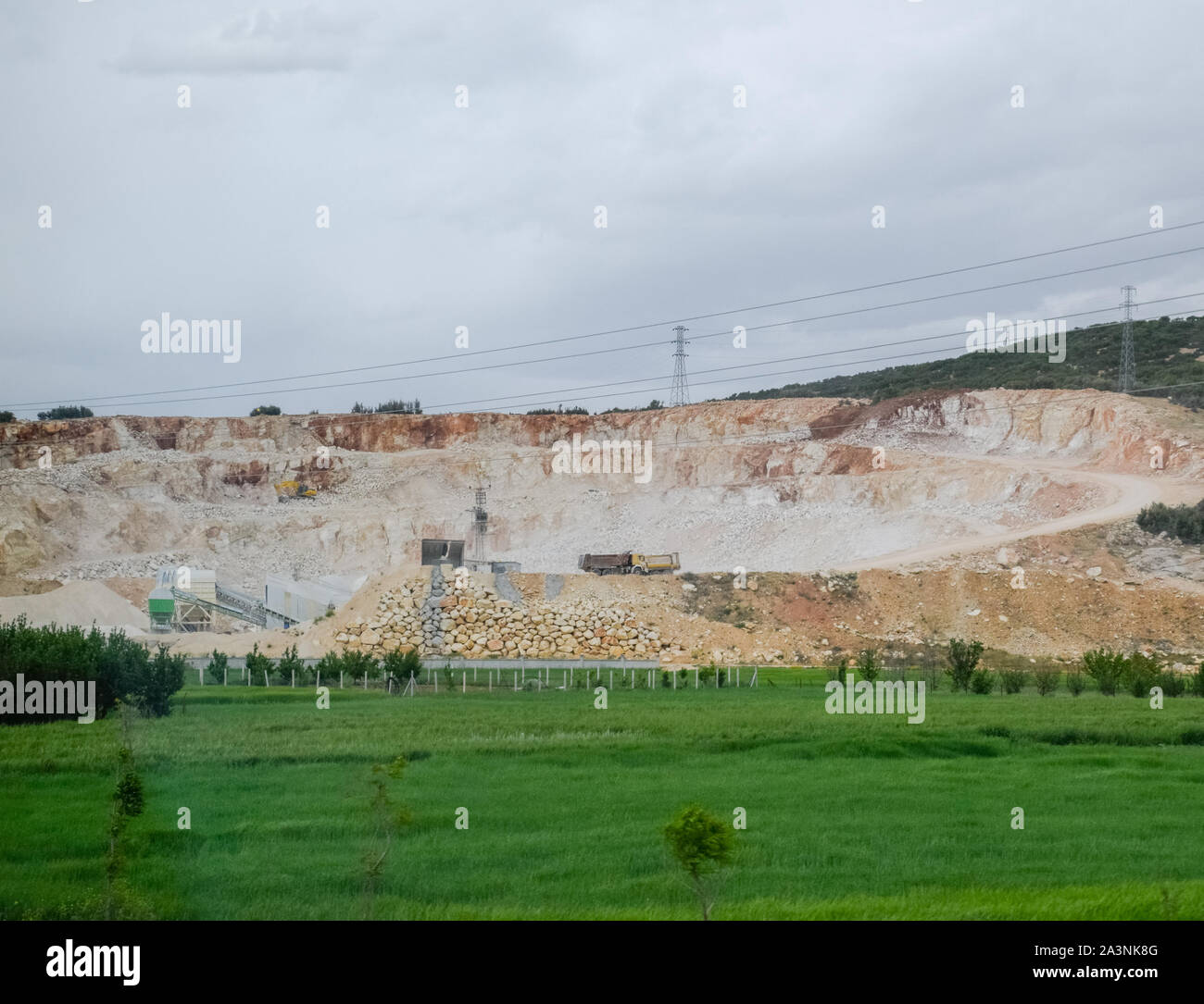 Marble quarry quarrying white marble in an open pit Stock Photo - Alamy
