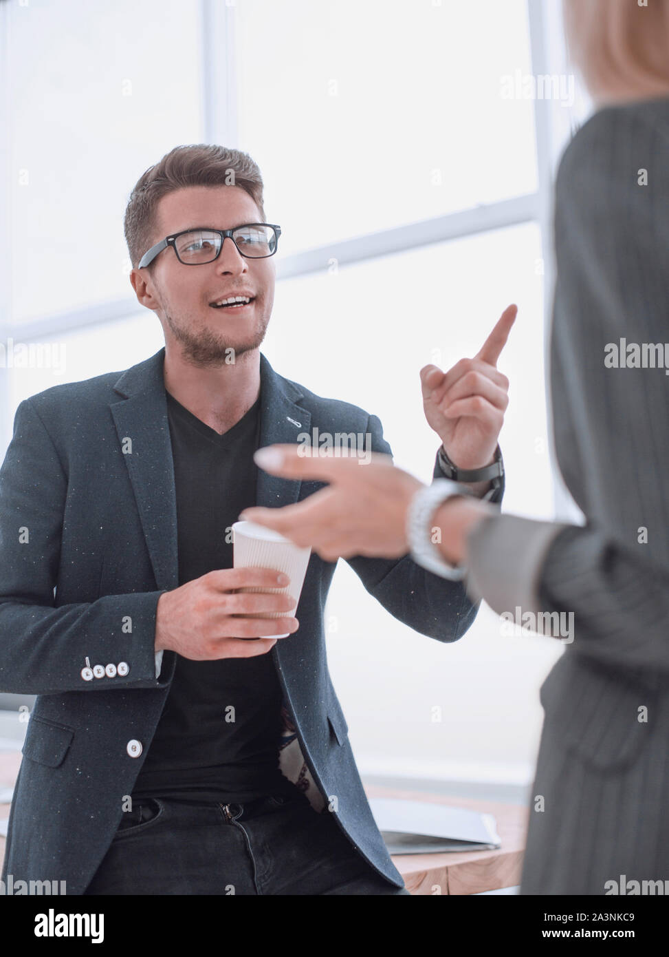 close up.a young employee explaining to a colleague his ideas Stock ...